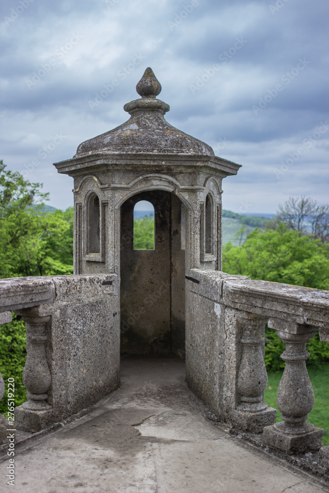The medieval architecture of Europe. Old stone castle. Pidhirtsi Castle ...