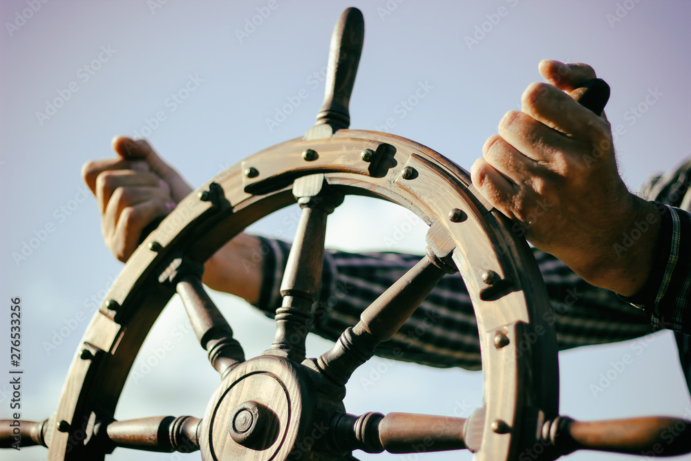 Steering hand wheel ship on sky background, hand hold hand wheel Stock ...