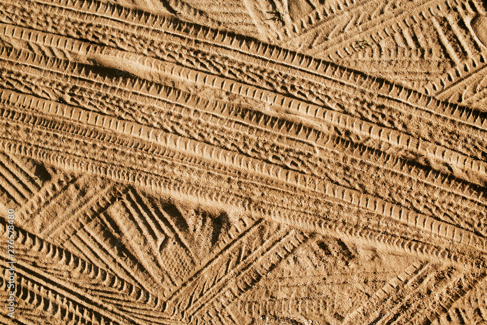 Tyre mark shape lines on dry yellow sand pattern. Stock Photo | Adobe Stock
