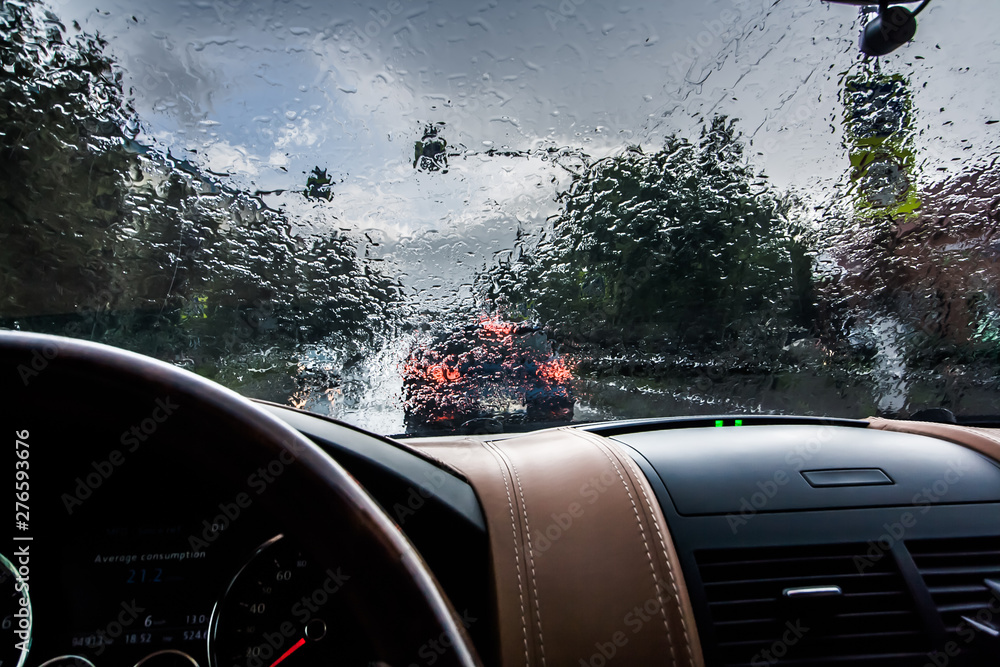 Car driving in the rain. view from the inside. raindrops on the ...