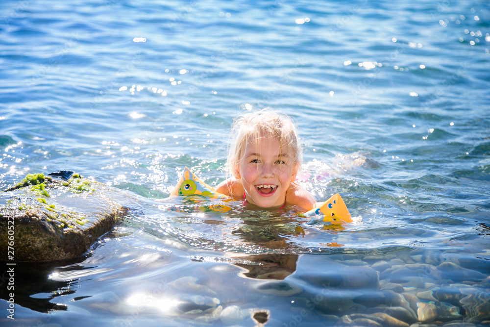 Kids At The Beach Swimming