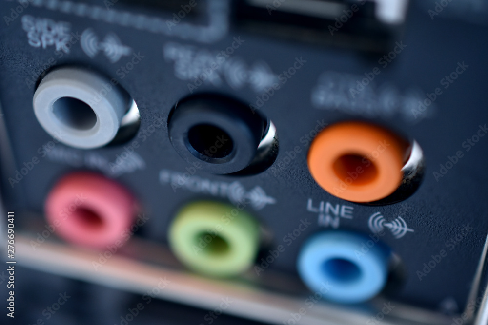 audio inputs on the rear panel of the computer system block, blurred ...
