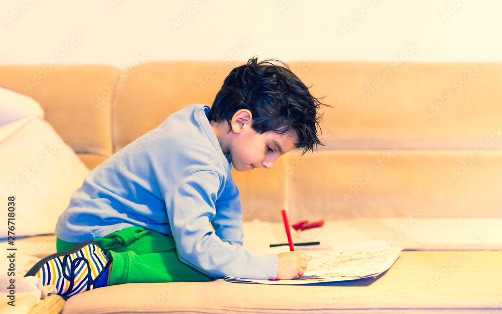 Boy Coloring With Crayons