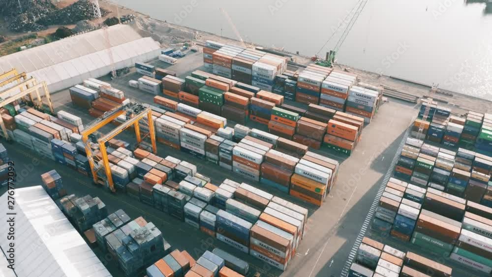 Cargo containers in port, aerial top down view. Freight ship unloading ...