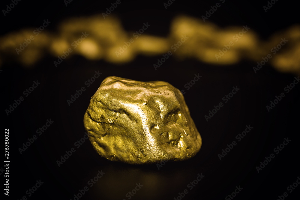 Golden stone in high resolution. Gold on black background isolated ...