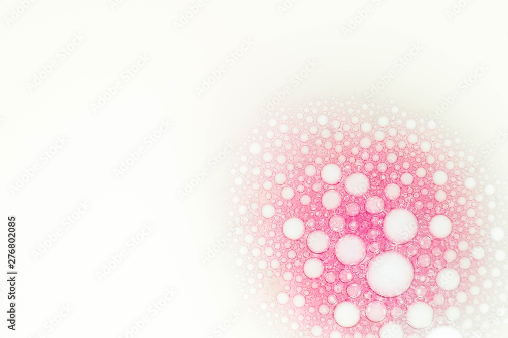 pink bubbles looking like cells through the microscpe, useful as a ...