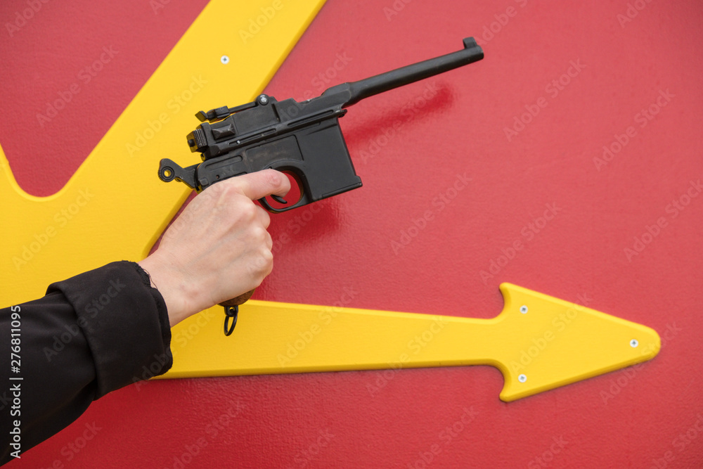 Hand with a gun on a red background. Life-size weapons mockup. Summer ...