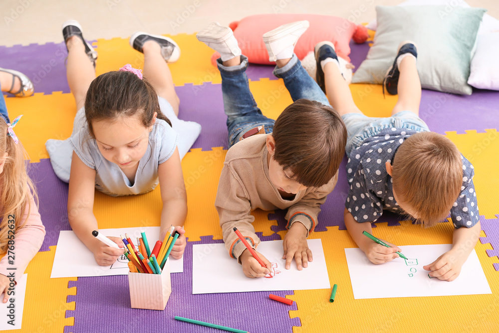 Cute little children drawing in kindergarten Stock Photo | Adobe Stock