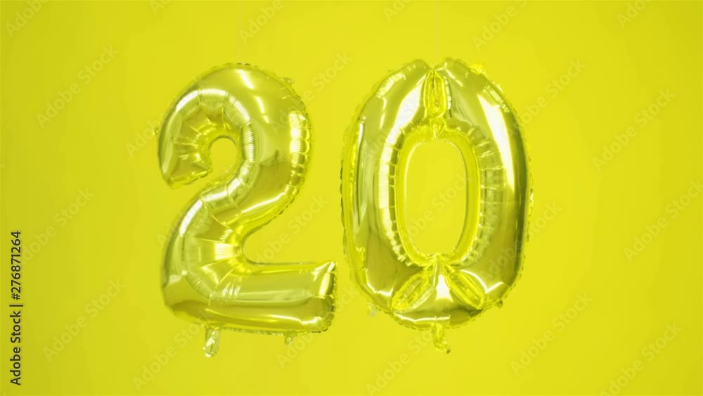Big golden ball of number twenty on a yellow background. Bright ...