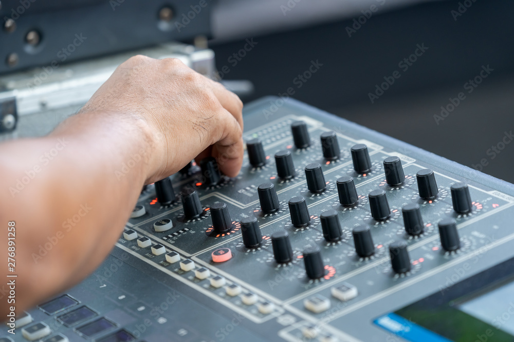 Hand adjusting audio mixer sound technician control panel the music ...