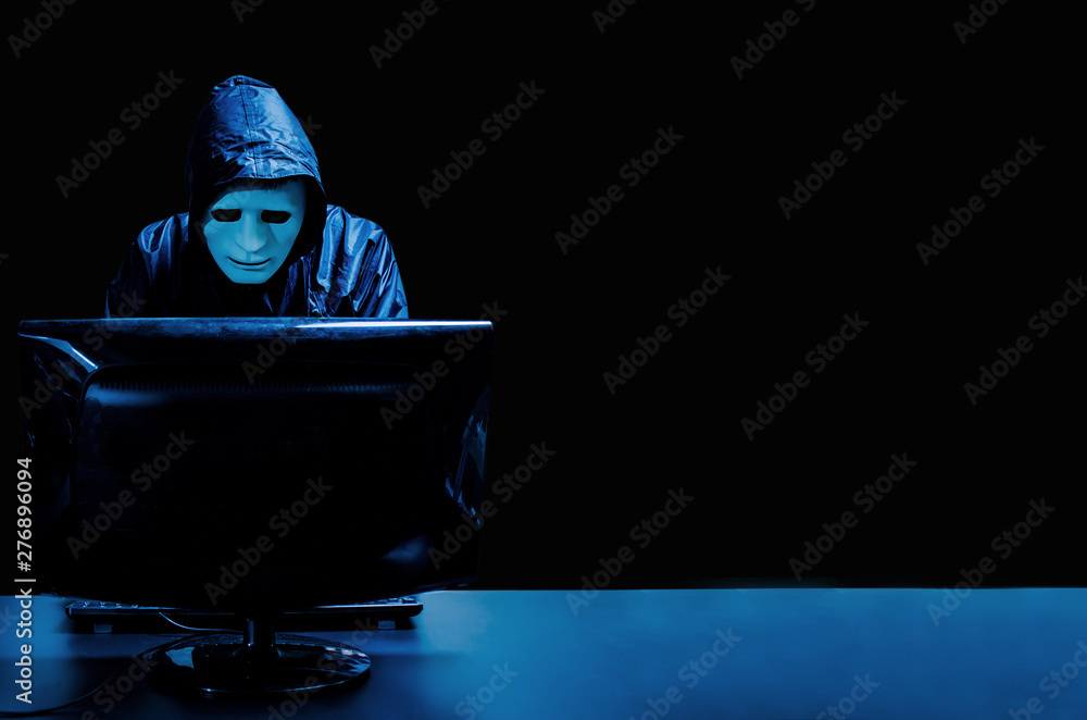 Anonymous computer hacker in white mask and hoodie. Obscured dark face ...