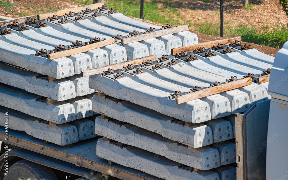 Pile of precast concrete sleepers ready for construction in trackwork ...
