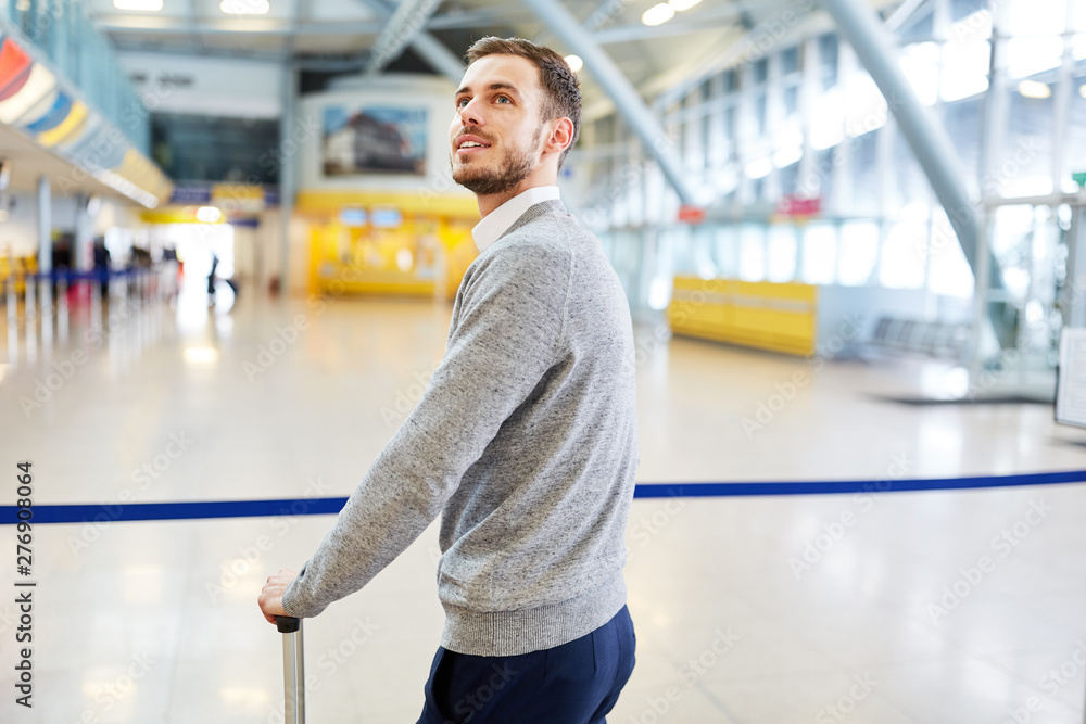 Solo traveler man as a passenger in the terminal Stock Photo | Adobe Stock