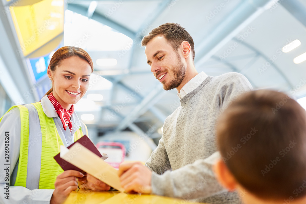 Man and service agent at check in counter Stock Photo | Adobe Stock
