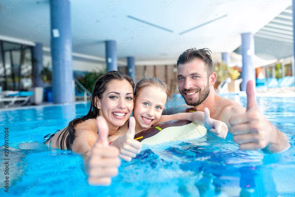 Smiling happy people in the swimming pool Stock Photo | Adobe Stock