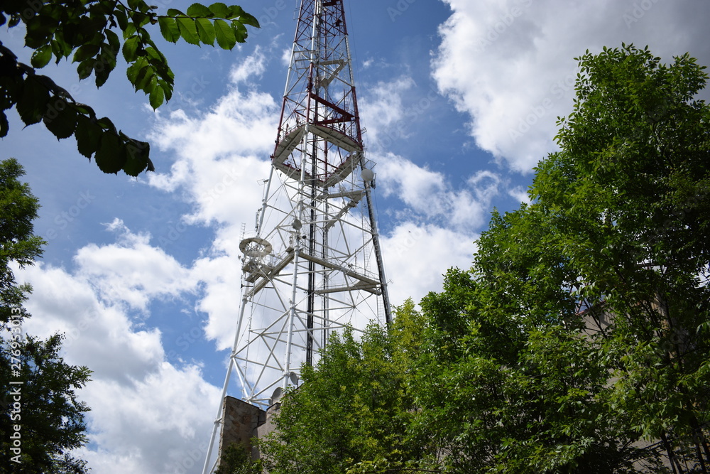 Telecommunication towers include of radio microwave and television antenna system with cloud ...