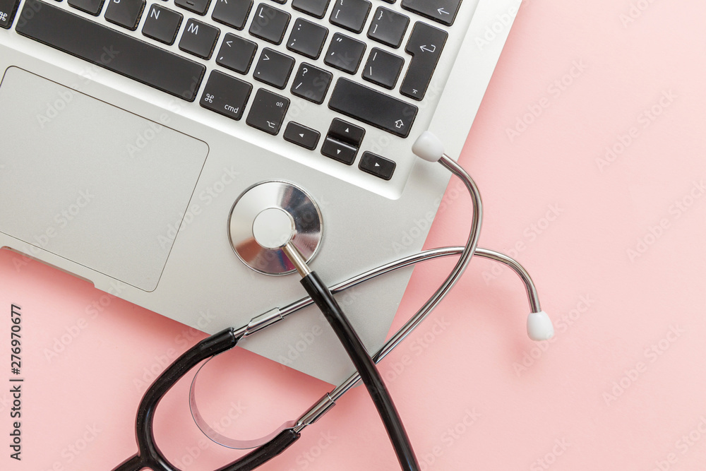 Stethoscope keyboard laptop computer isolated on pink background ...