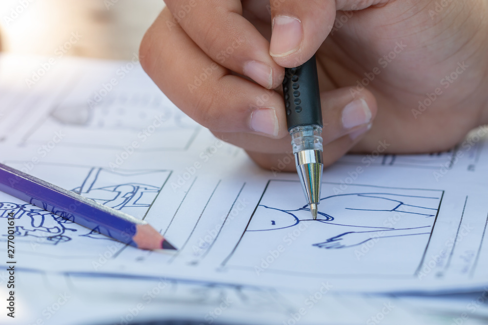 Hands drawing storyboard animation comic for pre-production process ...