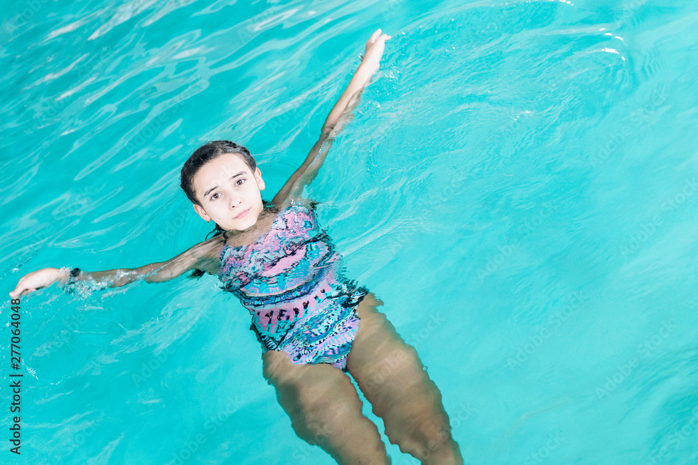 Girl swim in the pool. Happy girl play in the pool.Beautiful girl swim ...