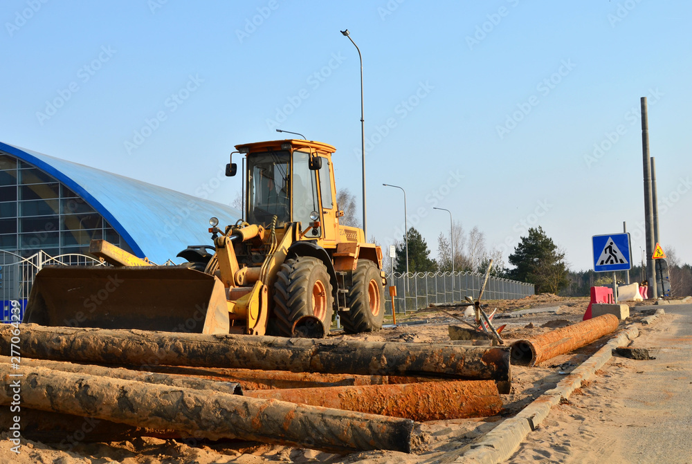 Front-end loader working on construction site during the renovation of ...