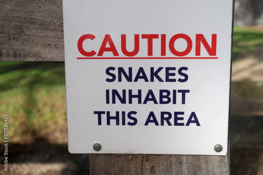 Caution sign warning of snakes in public area Stock Photo | Adobe Stock
