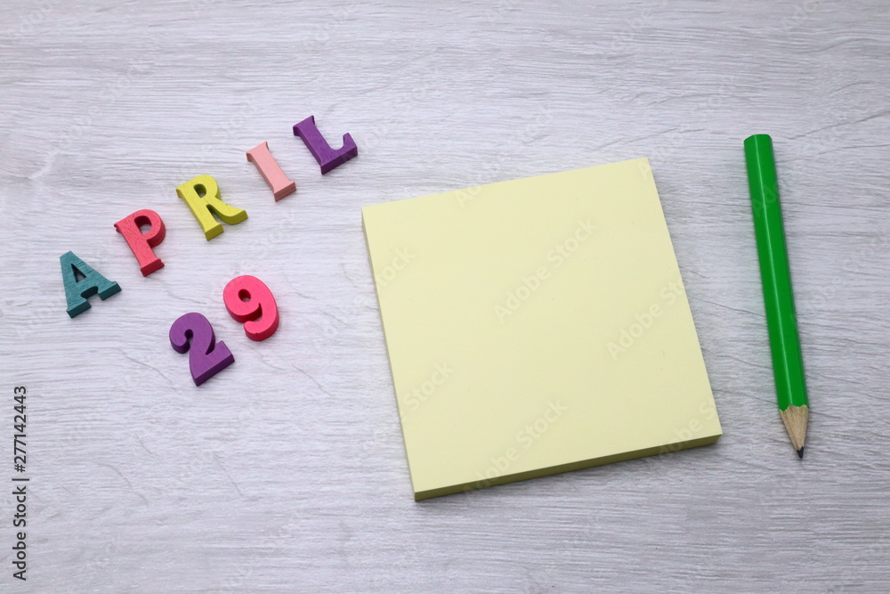 April 29 - Daily colorful Calendar with Block Notes and Pencil on wood ...