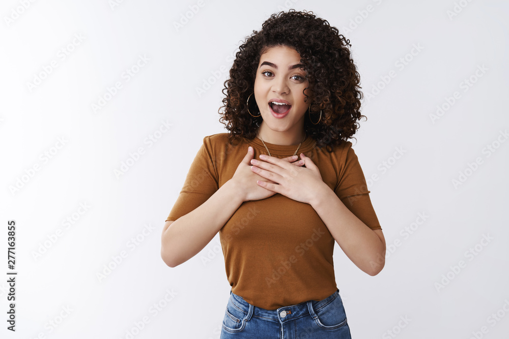 Touched amazed surprised pretty curly dark hair girl speechless ...