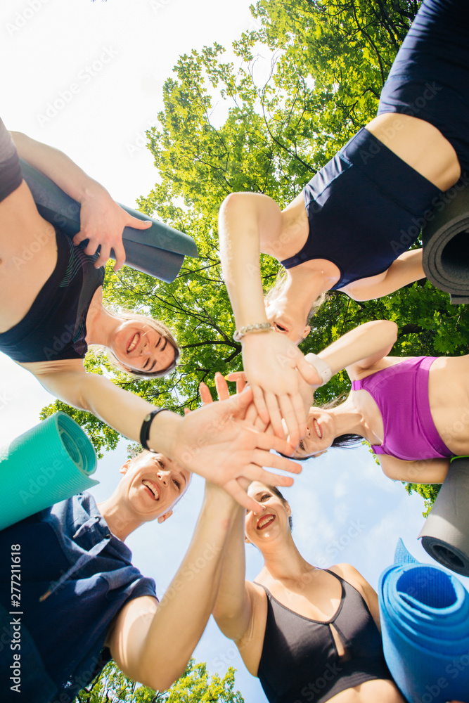 Team Huddle Hands Up Girls