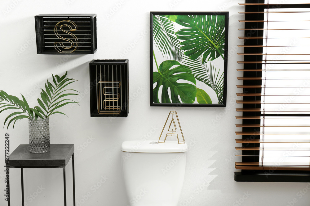 Table with vase and shelves near toilet bowl in restroom interior Stock ...
