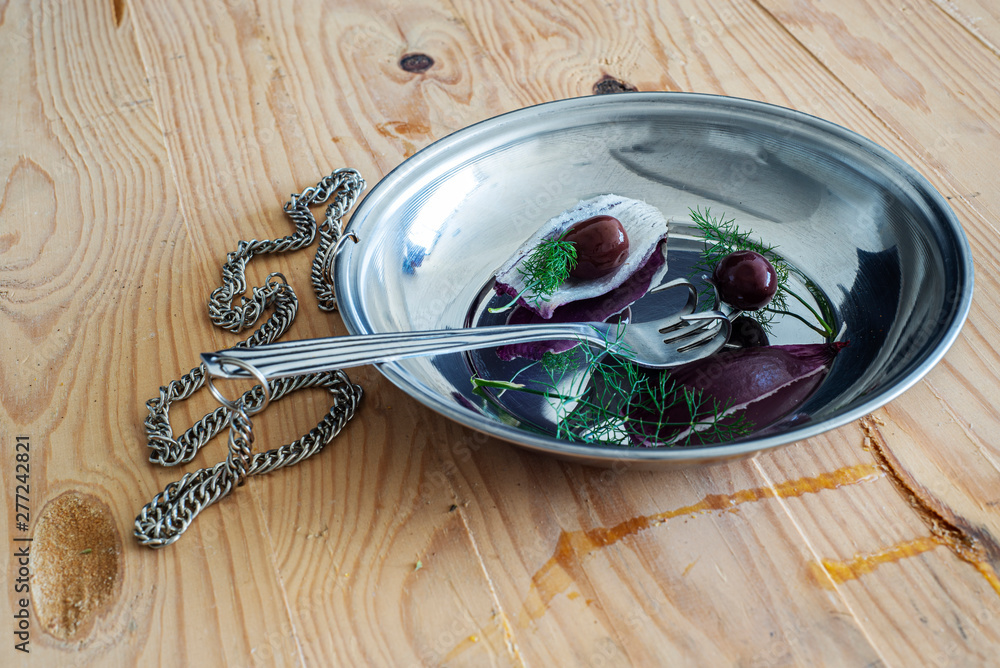 Fork deformed like a human hand, olives, dill, and red onions Stock ...