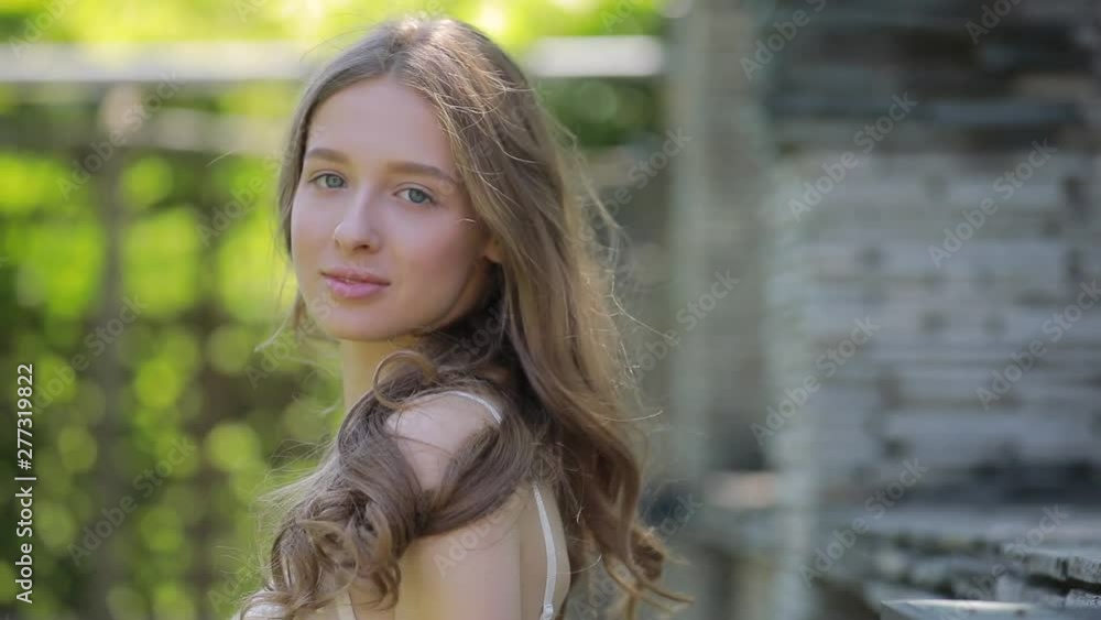 Fashion model with beautiful hair in lingerie turning face looking over ...