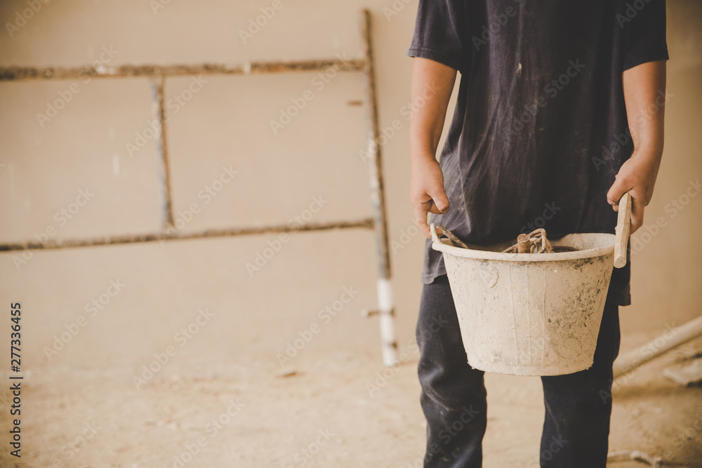 Little boys labor working in commercial building structure, World Day ...