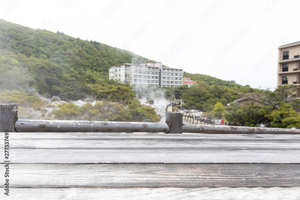 Empty wooden table and blur background of hell hot springs located at ...
