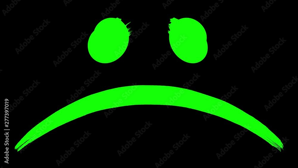 Brush draws a primitive sad face in chroma key green paint on black ...