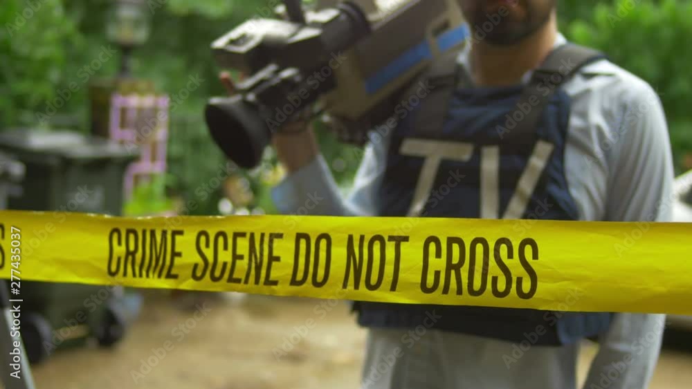 camera guy with an eng broadcast crime scene Stock Video | Adobe Stock