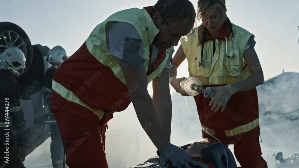 On the Car Crash Traffic Accident Scene: Paramedics Saving Life of a ...