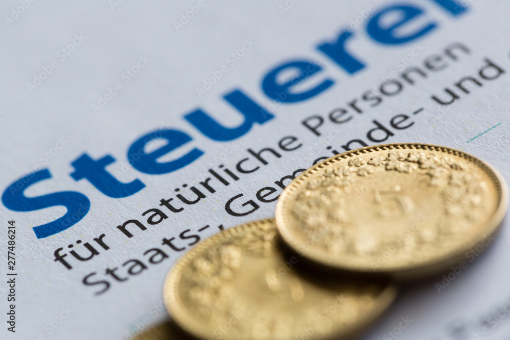 Swiss golden coins and Zurich tax declaration form Stock 写真 | Adobe Stock