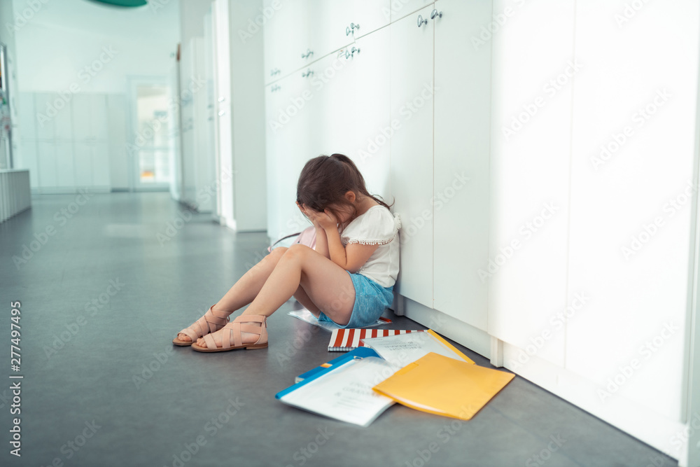 Little girl crying after awful first day at school with mockery Stock ...