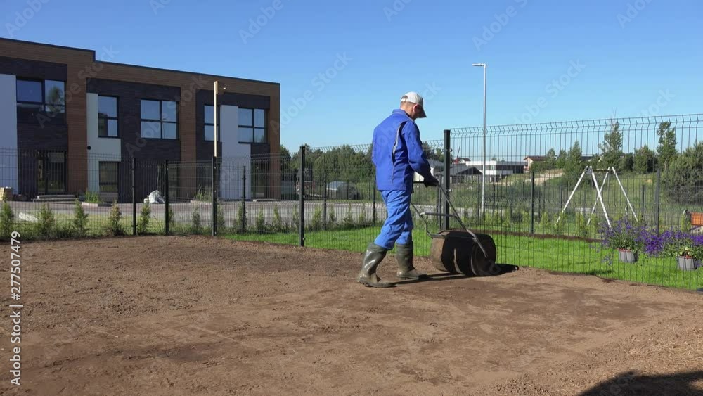 Ground harden works after lawn seeding. Static shot Stock Video | Adobe ...