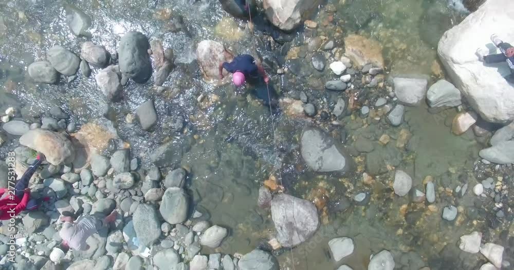 Flowing water of holy Ganges river India. Rope rescue, crossing river ...