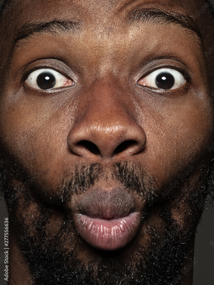 Close up portrait of young and emotional african-american man. Highly ...