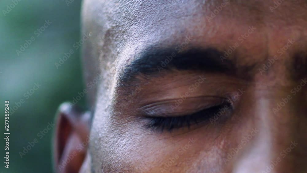 Black man opening his eye and smiles, extreme close up. Stock Video ...