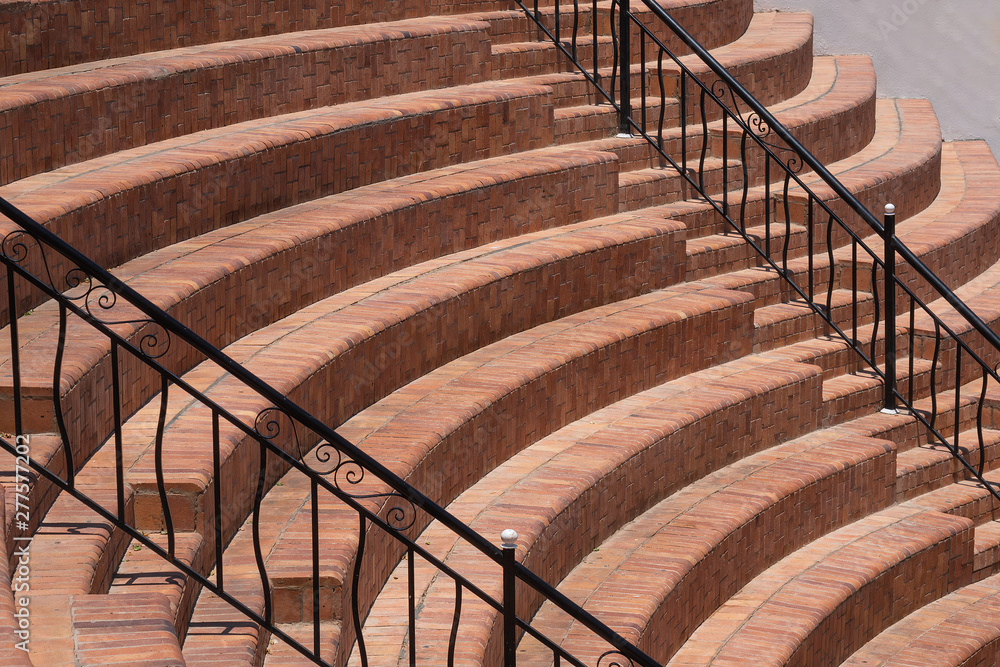 sector with black metal railings, brickwork, a fragment of the seats ...
