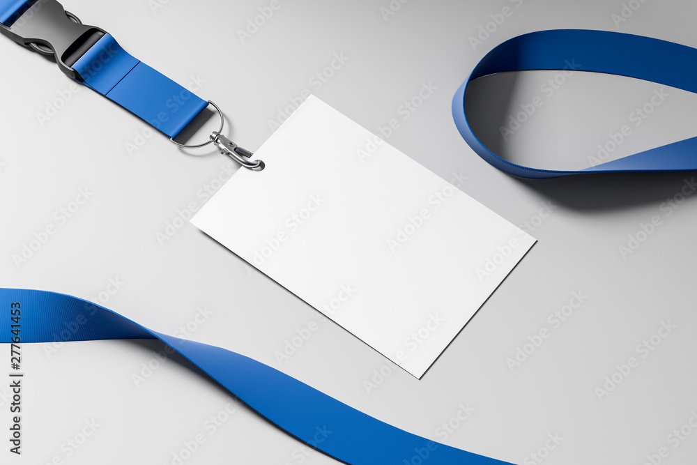 ID card with blue ribbon on white desk in light studio. Place for text ...