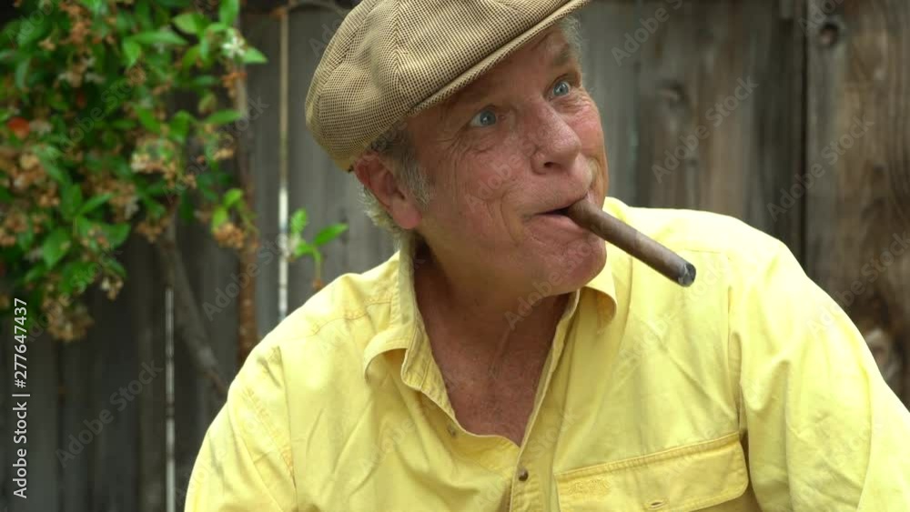 Crazy and funny old man wiggling cigar in his mouth and making ...