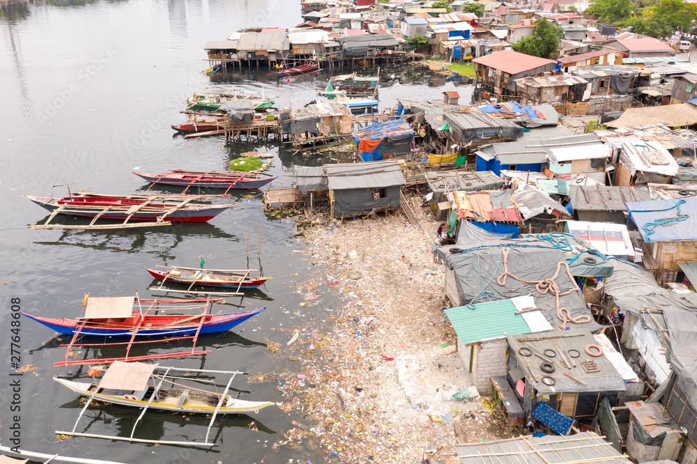 Houses and boats of the poor inhabitants of Manila. Dwelling poor in ...