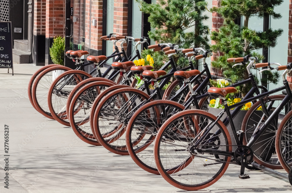 Aligned row of typical bikes on the street in Soho Manhattan New York ...