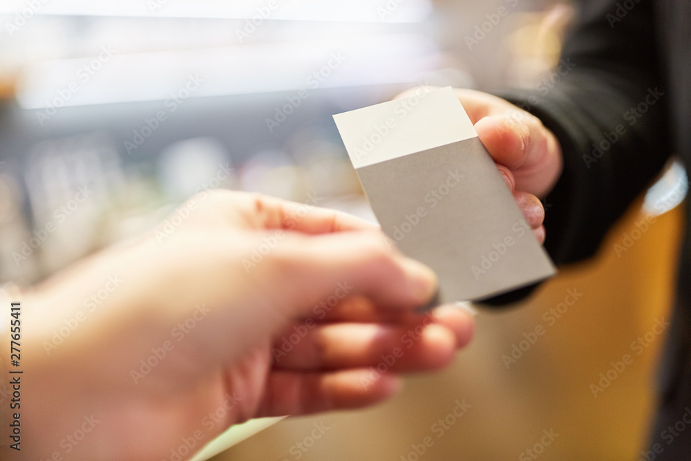 Businessman hands over a business card Stock Photo | Adobe Stock