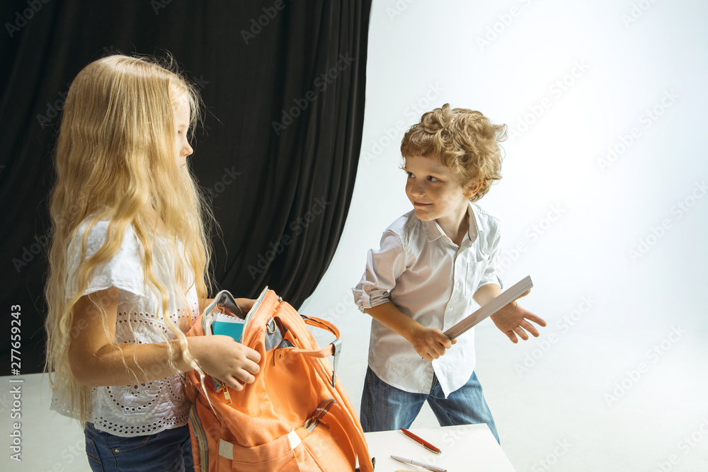 Boy and girl preparing for school after a long summer break. Back to ...