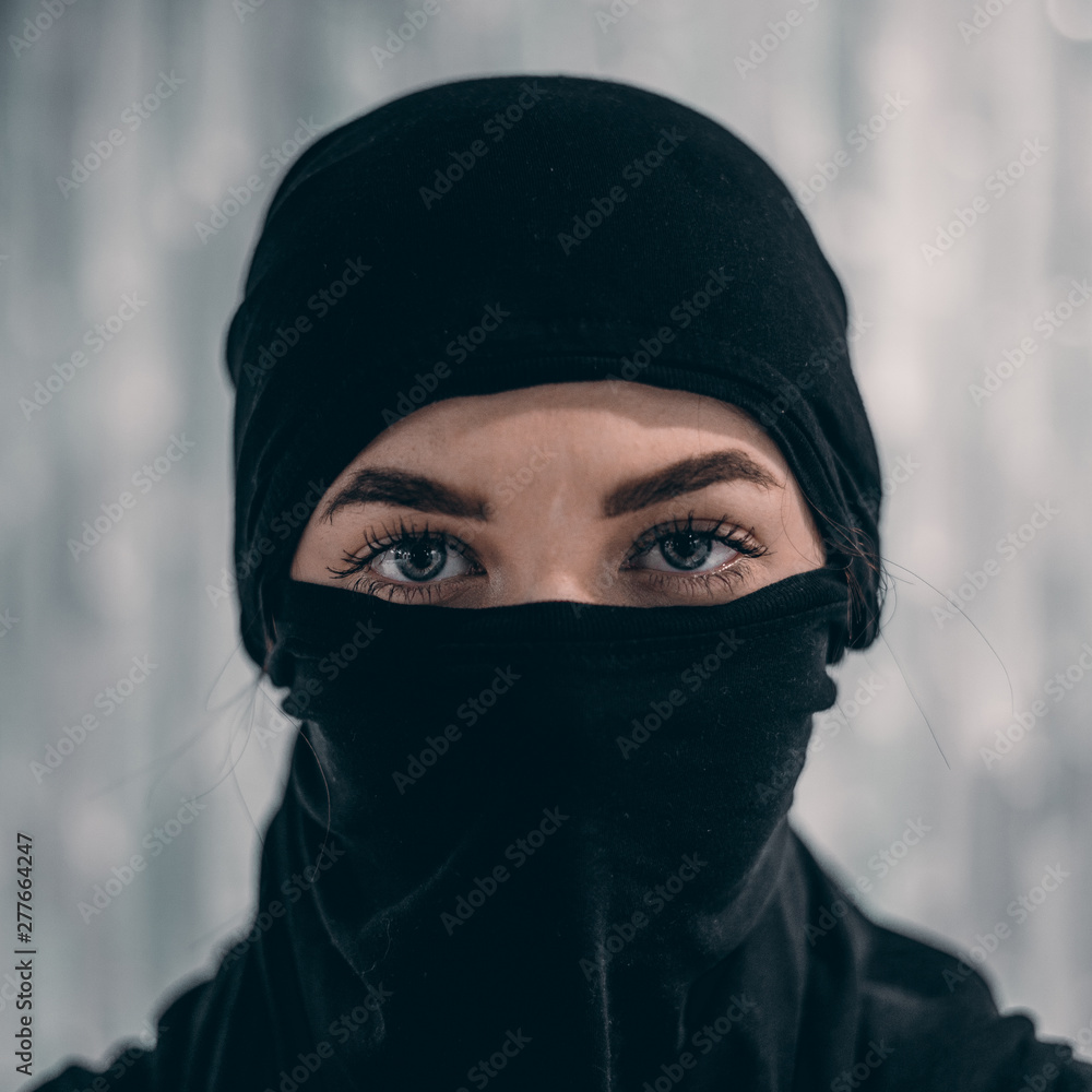 Woman portrait with deep eyes and eyelashes beauty make up, wearing ...
